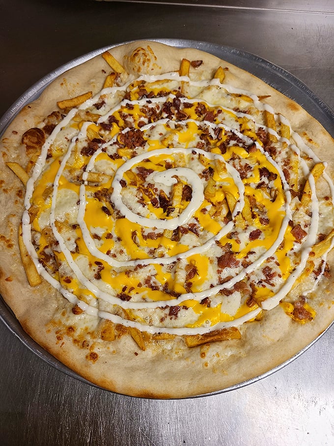 The loaded fries pizza is what happens when two favorite comfort foods meet, fall in love, and create something beautifully rebellious.