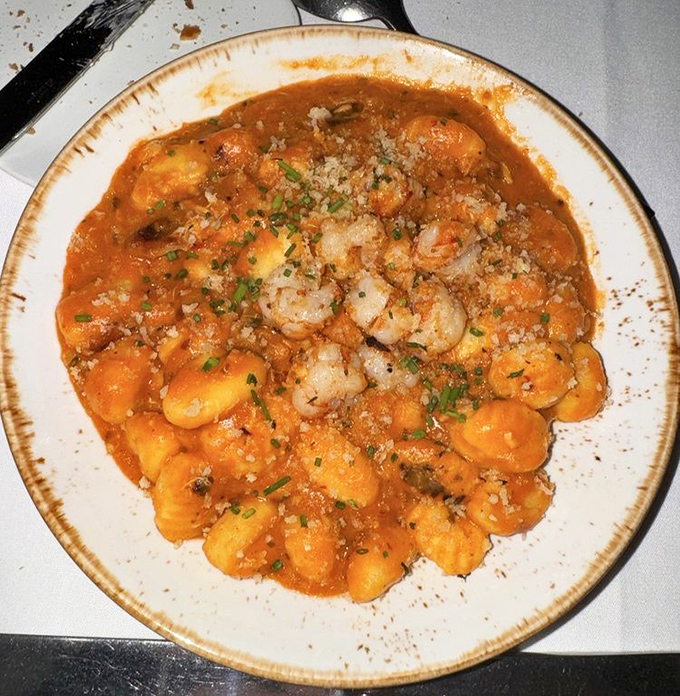 Gnocchi swimming in a tomato sea alongside plump shrimp—a dish that makes you want to hug the chef in gratitude.