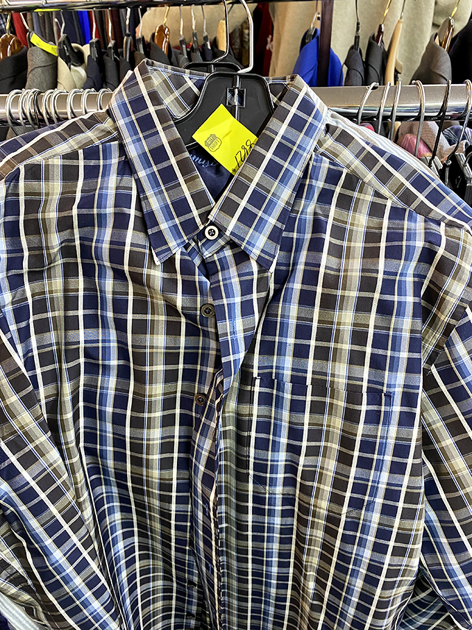 A perfectly good plaid shirt awaits its next adventure. Someone outgrew it, changed styles, or simply cleaned their closet &ndash; their loss, your gain!