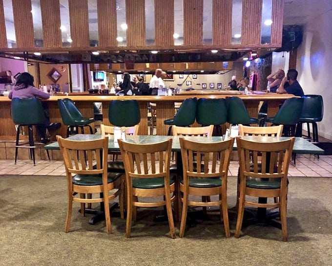 The bar area offers a different vantage point for diner devotees. Those green chairs have supported generations of satisfied customers.