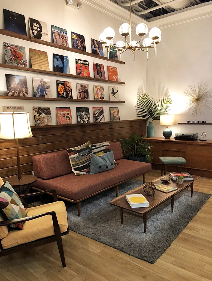 The lounge area feels like the coolest friend's living room, complete with vinyl album display. The perfect spot to digest those cornmeal pancakes.