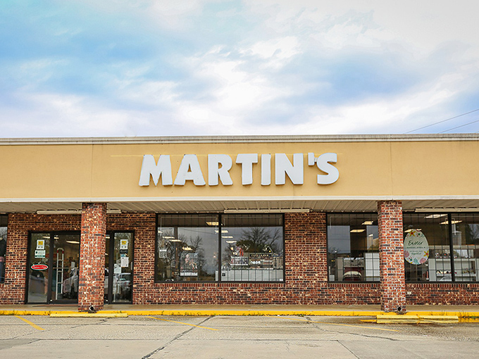Martin's storefront welcomes shoppers with brick columns and clear signage, representing local business that's outlasted countless chain-store openings and closings elsewhere.
