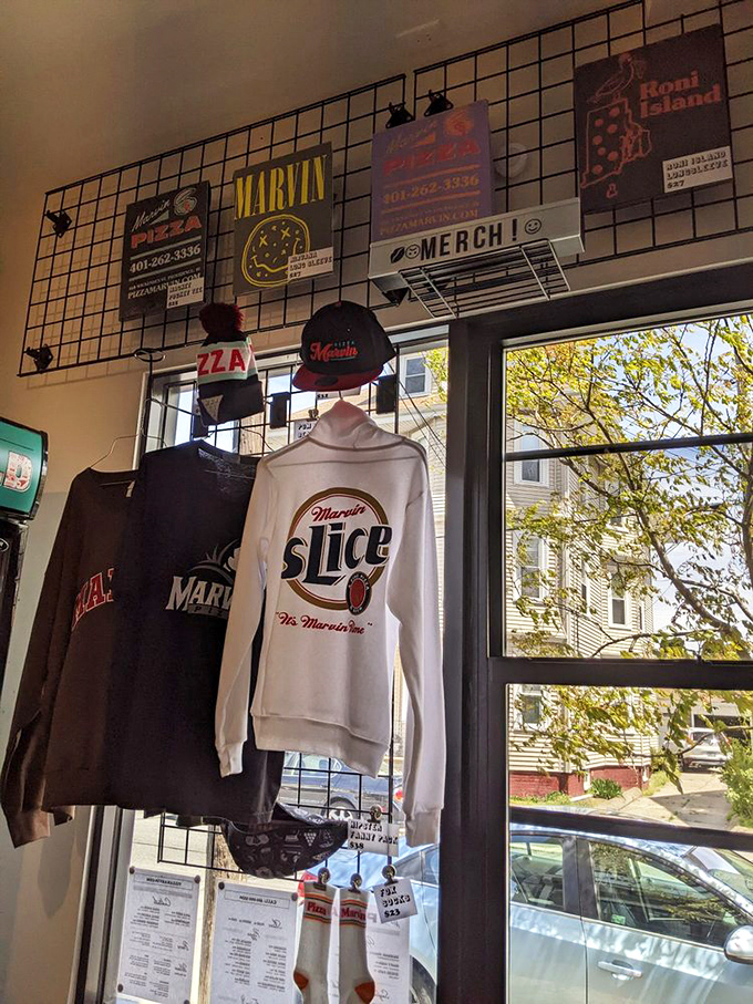 Pizza Marvin merch hanging proudly says what we're all thinking: this place isn't just a meal, it's a lifestyle worth representing on your chest.