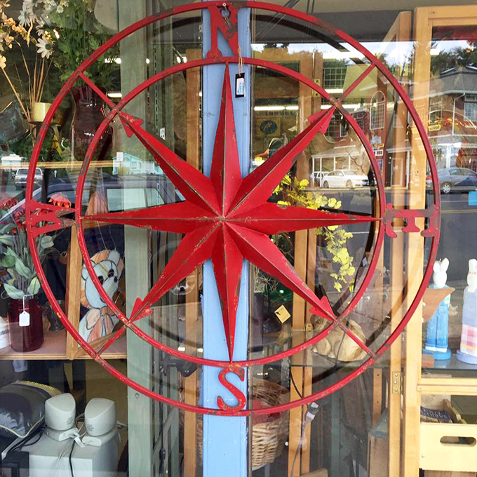 A compass rose that once guided sailors now guides interior decorators. This metal beauty would make any wall look like it belongs in a coastal design magazine.