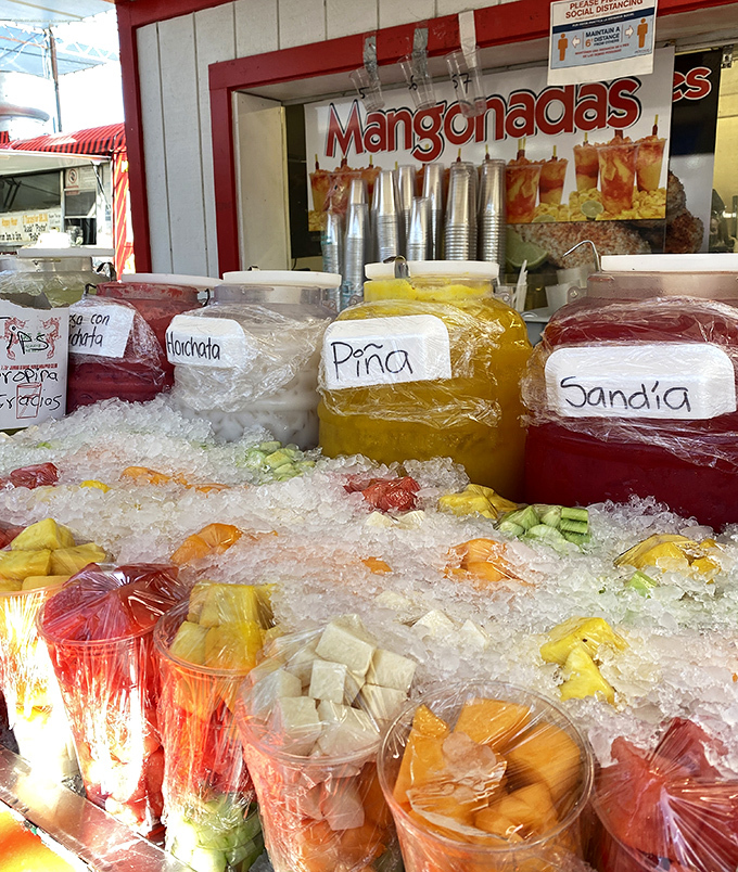 Fresh mangonadas glisten like jewels on ice, offering sweet relief from California sunshine and shopping fatigue combined.