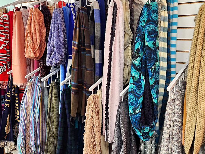 Scarves in every color and texture hang ready to elevate your winter wardrobe game instantly.