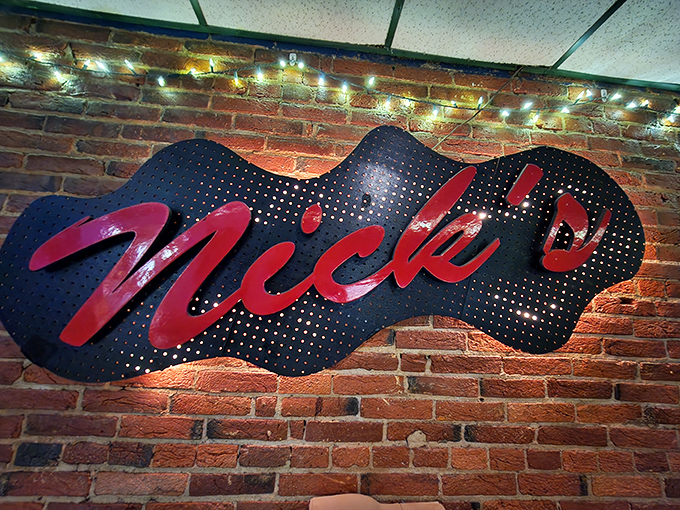 That illuminated Nick's sign against the brick wall isn't just decor—it's a beacon of hope for hungry souls seeking salvation in the form of smoked meats.