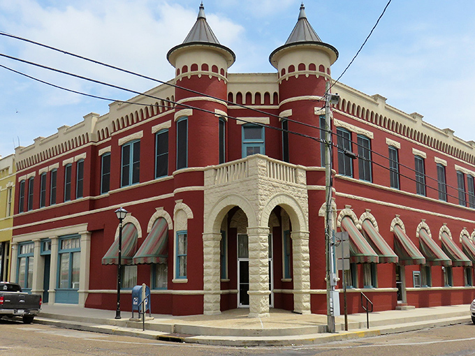 The Old Bank of Abbeville building stands as a cornerstone of downtown, its distinctive red turrets like exclamation points on the town's architectural story.