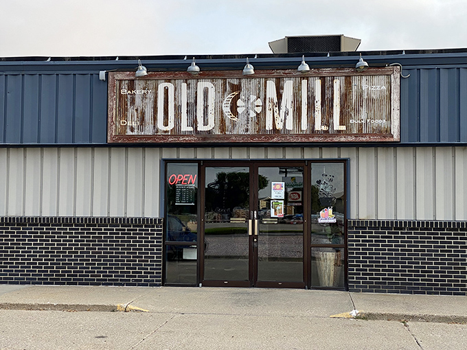 The Old Mill's weathered sign speaks to Valentine's appreciation for heritage, where rustic charm isn't manufactured but earned through decades of service.