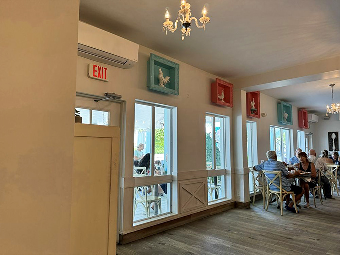 Sunlight streams through windows framed by coastal colors, creating the perfect backdrop for breakfast conversations that linger well past the last bite.