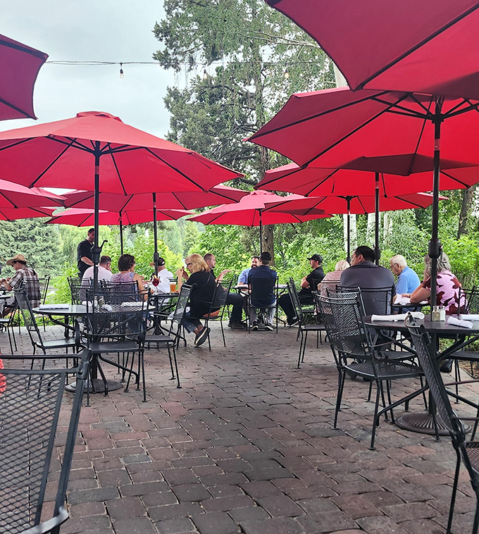 The outdoor patio&mdash;where red umbrellas create a canopy of color above diners enjoying Bend's perfect summer weather.