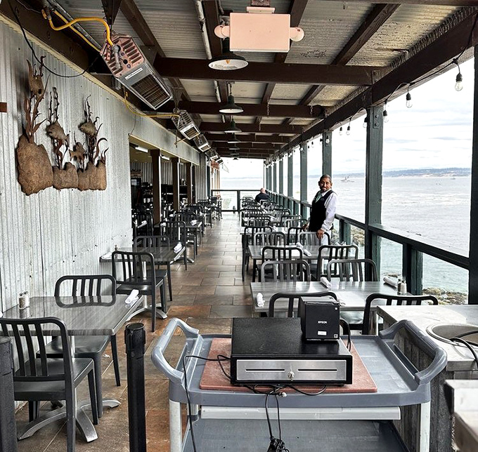The covered patio offers al fresco dining with protection from coastal breezes&mdash;nature and comfort in perfect harmony.