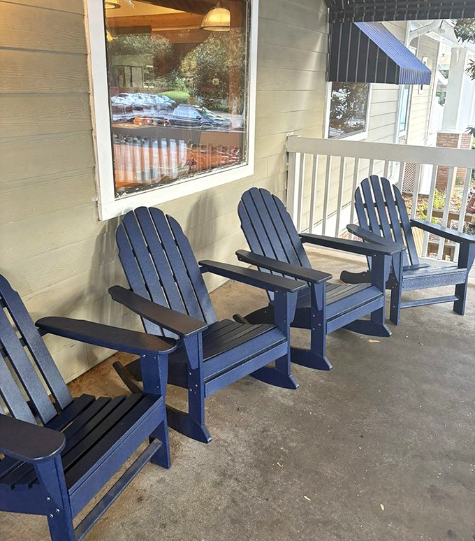 Blue Adirondack chairs on the porch offer the perfect waiting spot to contemplate life's big question: how many donuts is too many?