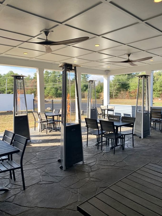 The outdoor patio where summer evenings become magical&mdash;heat lamps standing guard against New Hampshire's cooler nights while you savor ocean treasures.