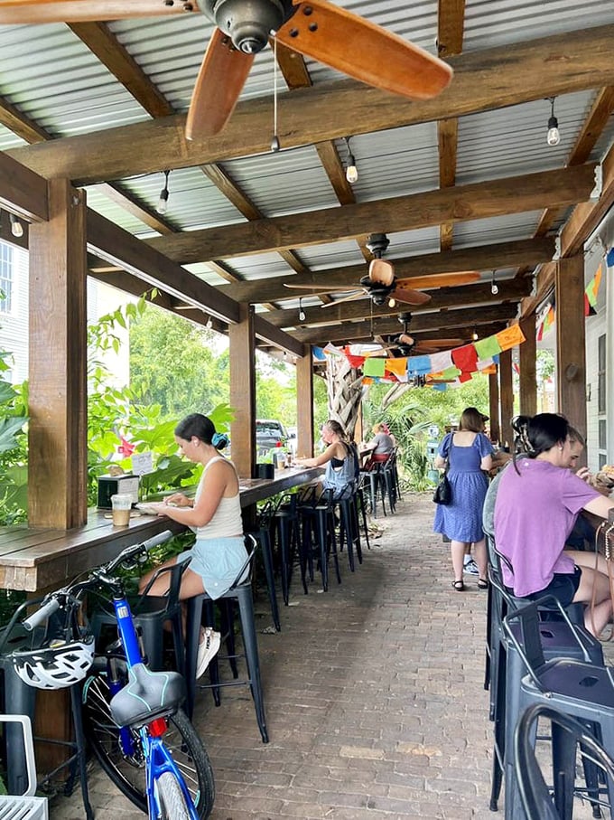 The covered patio offers prime people-watching real estate while you sip your coffee and contemplate a second helping.