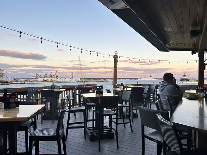Sunset views from the deck make even waiting for a table feel like part of the experience rather than a delay.