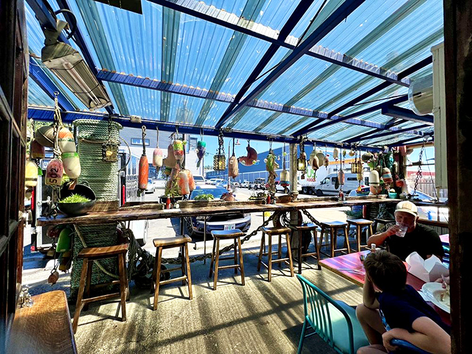 The covered patio offers front-row seats to Newport's working waterfront &ndash; dinner and a show, no extra charge.