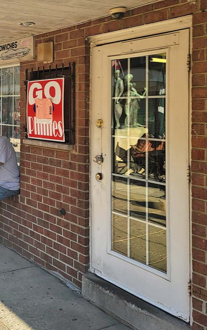 The entrance says everything: unpretentious, straightforward, and proudly sporting Philadelphia sports loyalty like a badge of honor.