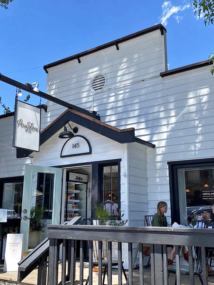 The white cottage exterior with its welcoming porch practically whispers, "Come in, we have carbs." A bakery that looks like it was plucked from a fairytale and placed in Wyoming.