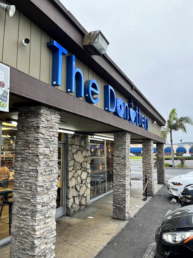 The cheerful exterior sign practically glows with the promise of carbohydrate happiness waiting just beyond those doors.