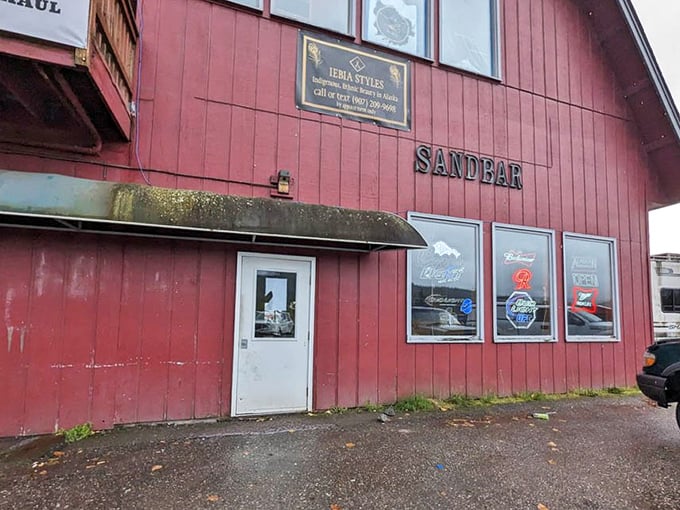 The "SANDBAR" sign on the weathered red exterior doesn't need to shout&mdash;locals already know what treasures await inside these walls.