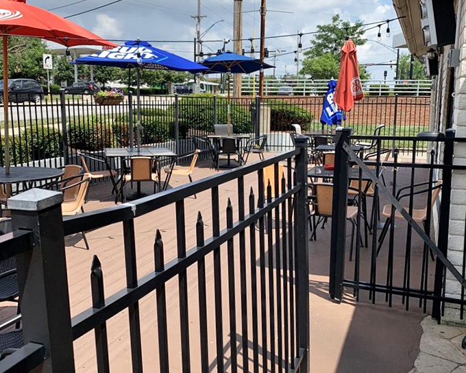 The patio at Jimmy's offers that rare combination of people-watching opportunities and enough privacy to argue about whether pineapple belongs on pizza.