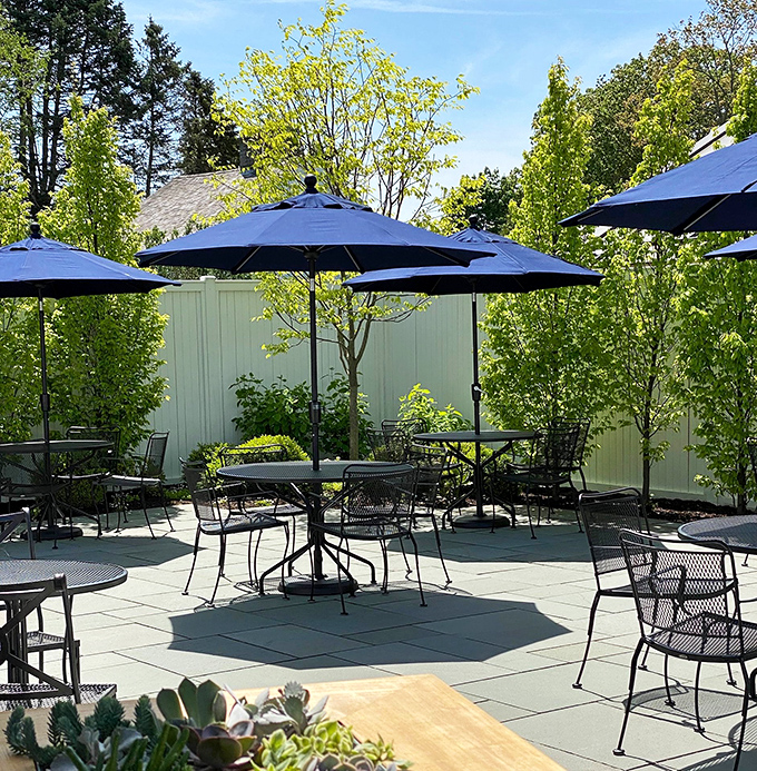 Summer brings al fresco dining under navy blue umbrellas, where the Connecticut breeze carries hints of nearby salt water to complement your meal.