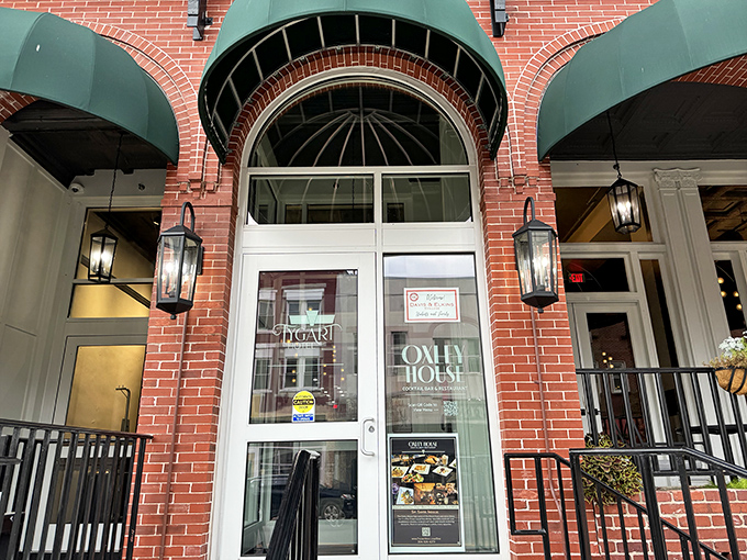 The Oxley House entrance whispers "elegance" while the green awnings add just enough color to keep things interesting.