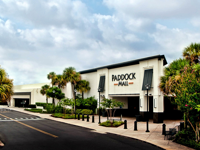 Paddock Mall's elegant entrance suggests shopping with a side of sophistication, where palm trees and retail therapy create the perfect Florida afternoon.