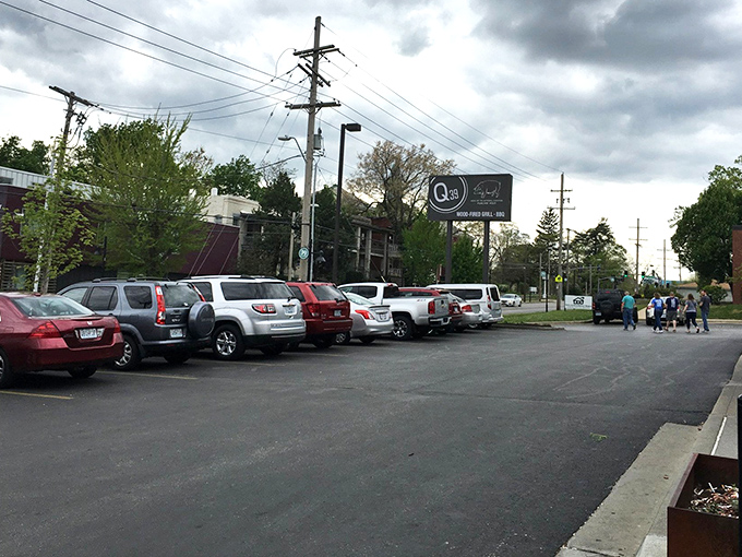 The packed parking lot tells you everything you need to know. In barbecue mathematics, full lot = empty plates = happy customers.