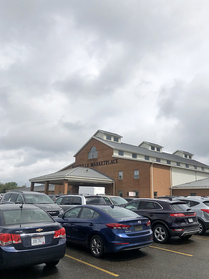 The barn-inspired architecture of Hartville MarketPlace stands ready for another day of commerce under moody Ohio skies.