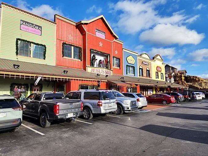Colorful storefronts line the parking lot like a retail rainbow, each promising treasure behind its doors.