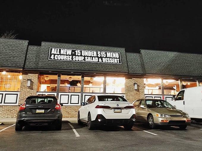 Even at night, the "15 under $15" sign glows like a beacon of hope for hungry wallets. Value never looked so inviting.