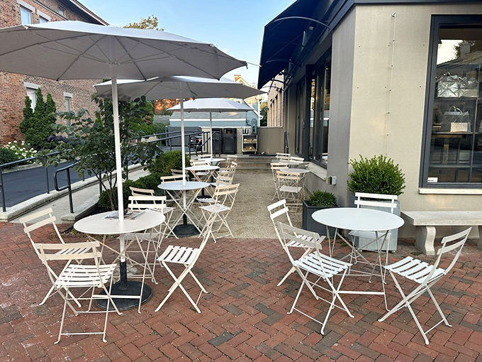 The charming patio with white bistro tables invites you to linger over coffee and croissants while pretending you're in a European plaza.