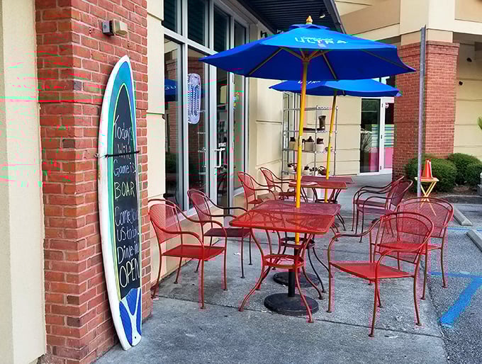 Even on cooler days, the cheerful red patio furniture and surfboard menu board maintain the beachy burger joint vibe.