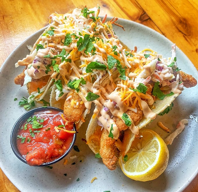 Perch tacos that bring Great Lakes bounty to tortilla territory, proving that cultural fusion tastes best with a squeeze of lemon.