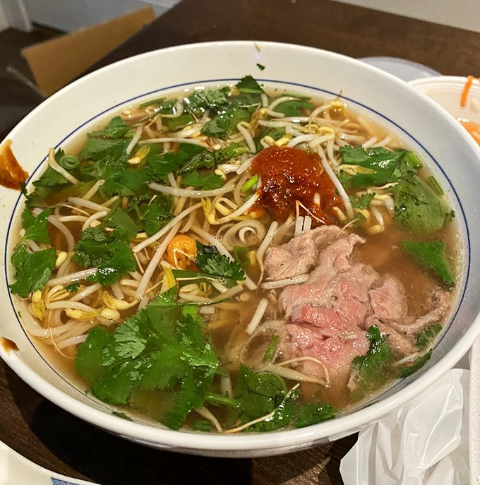 A bowl of phở so authentic it should come with its own passport—fragrant broth, tender beef, and fresh herbs creating a soup that's both comfort and adventure.