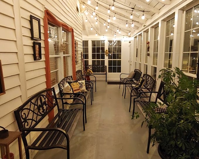 The evening porch transforms into a twinkling sanctuary where post-dinner conversations stretch into the night.