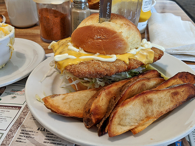 Not just a sandwich but a statement &ndash; golden-fried tenderloin spilling over its bun like it's trying to make an escape to your plate.