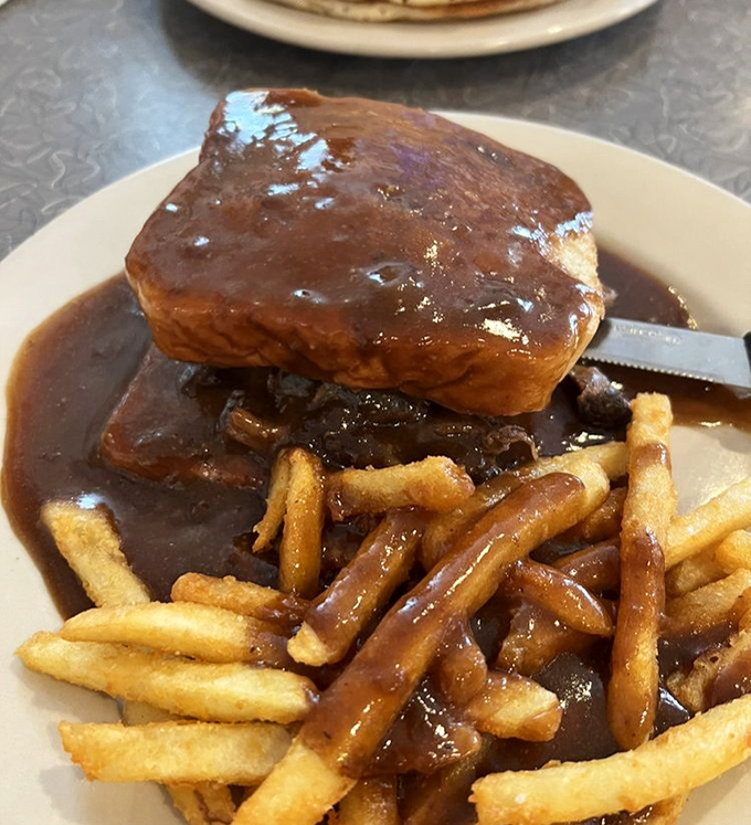 Not just pot roast&mdash;this is a gravy-drenched love letter to comfort food, with fries playing the willing accomplices. 