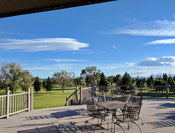Powell Golf Club's deck offers the perfect 19th hole view&mdash;where every missed putt is forgotten under that expansive Wyoming sky.