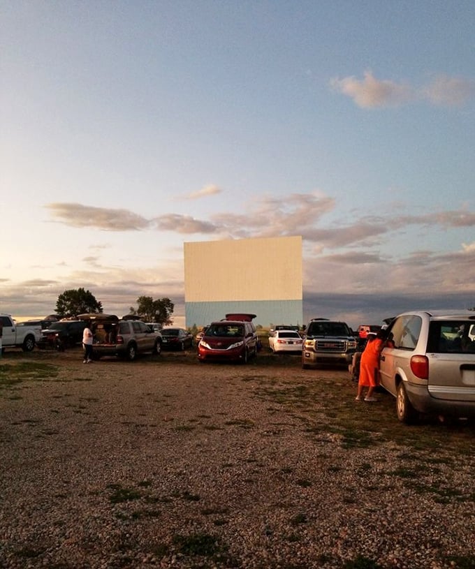 Dusk at the drive-in brings a special energy as vehicles find their spots and families prepare for the show to begin.