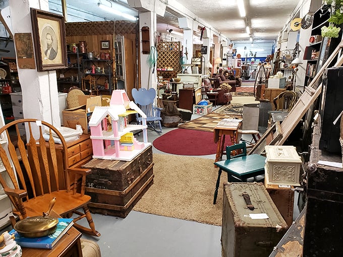 Furniture alley stretches into the distance like a time-traveler's hallway, where every chair has supported someone's weight and every trunk held someone's secrets.
