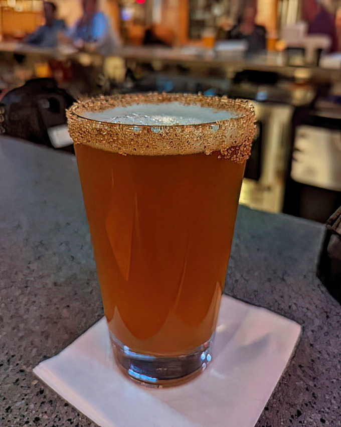 That amber beer with its salt-rimmed glass isn't just a drink&mdash;it's liquid sunshine with attitude, perfect for washing down spicy Cajun pasta.