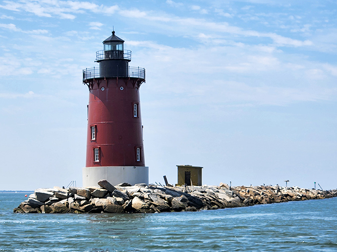 The Harbor of Refuge Lighthouse stands like a stoic sentinel, guiding boats and providing perfect backgrounds for vacation photos that will make your Facebook friends jealous.