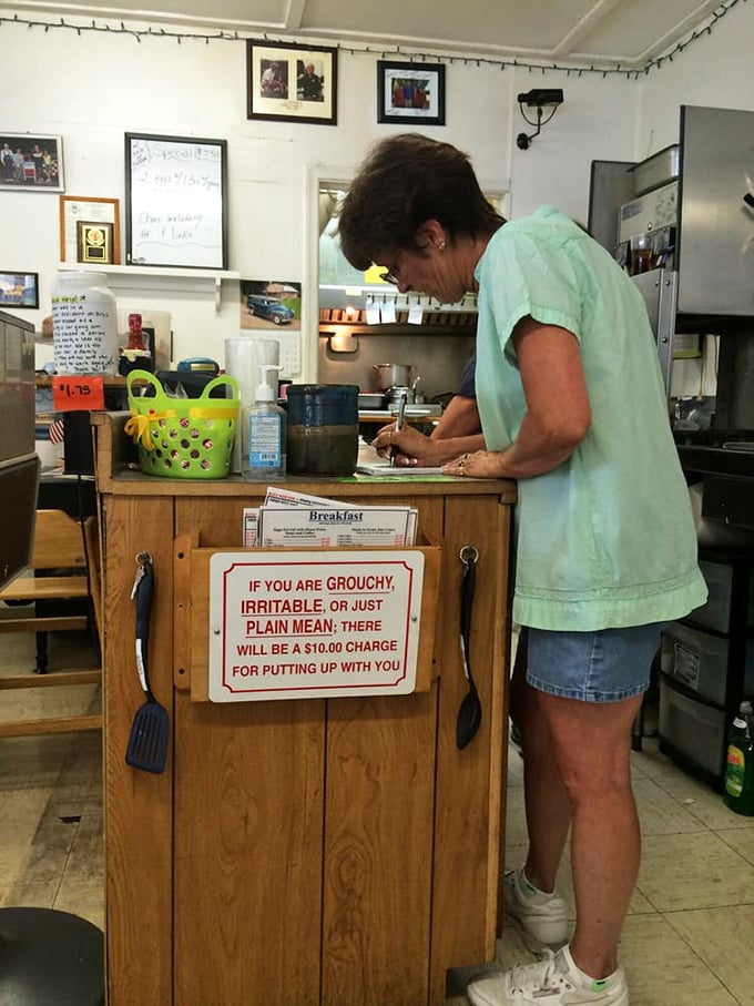 That "$10 charge for grouchy customers" sign tells you everything about the personality waiting inside Tammy's Diner.