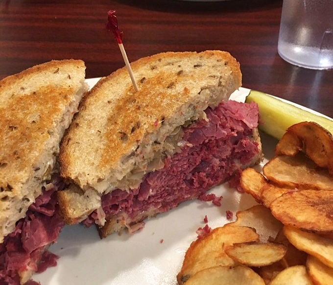 This Reuben isn't just a sandwich&mdash;it's architecture, history, and perfect balance in edible form. The chips are just showing off.
