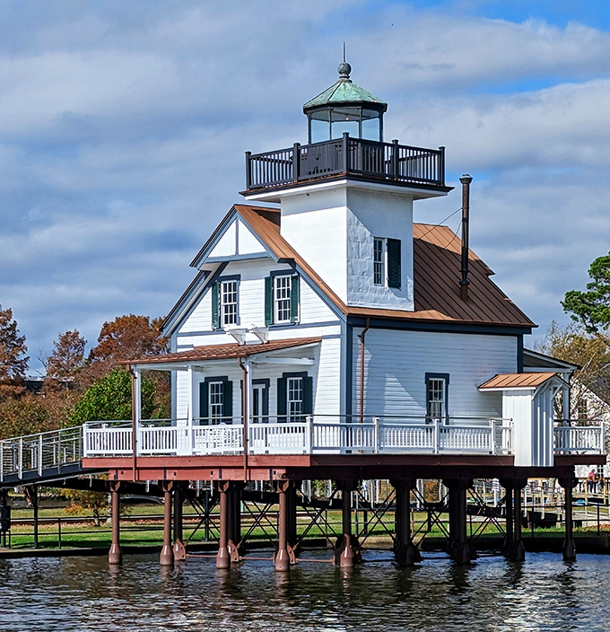 The Roanoke River Lighthouse perches above the water on stilts, a charming sentinel that's been guiding mariners home for generations.