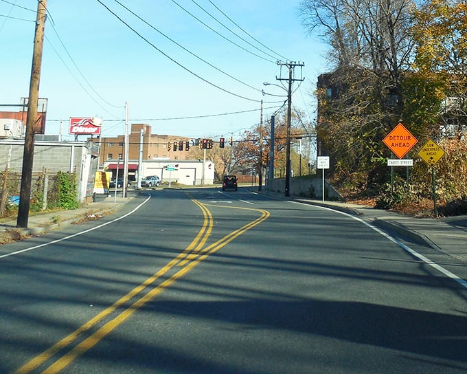 Sunlight stretches across Chicopee's roads like nature's own welcome mat, guiding visitors toward small-town experiences that big cities can't manufacture.