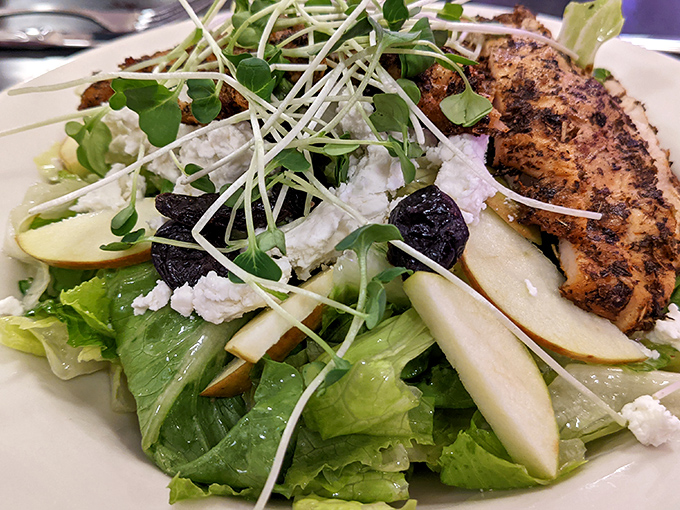 A salad that actually deserves to be ordered&mdash;crisp greens, fruit, and protein that won't leave you eyeing your dining companion's burger.